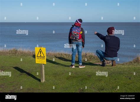 Two Visitors To The Dunwich Cliffs Dunwich Suffolk Ignore The Danger