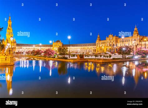 Plaza De Espana Reflected On Water During Night Sevilla Spain Stock