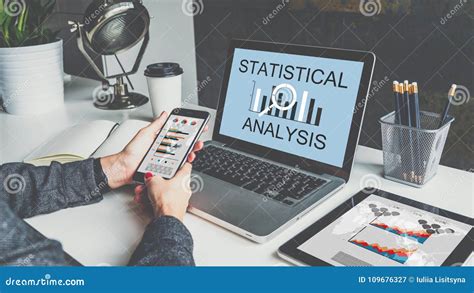 On Table Are Laptop With Inscription Statistical Analysis On Screen