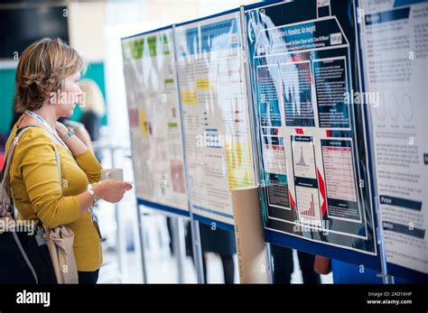 Optometry Conference Posters Delegate At An Information Stand With