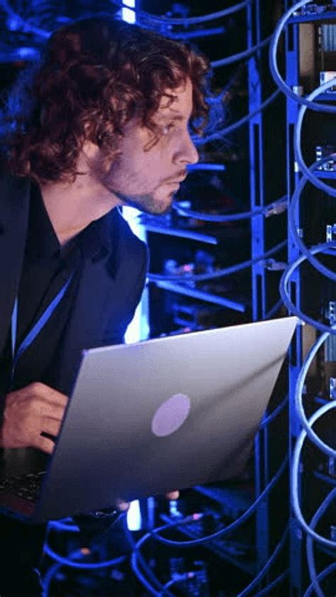 Man Analysing Data Server Room Vertical Stock Footage Video 100