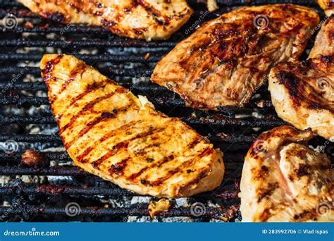 Chicken And Pork Steak Grilled On A Charcoal Barbeque Top View Of