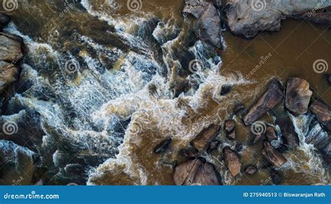 Beautiful Arial Drone View Of Water Spring Passing Through Rocks In