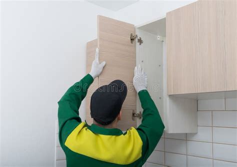 Master Kitchen Furniture Assembler Installs Door Facades On Top Drawers Stock Image Image Of