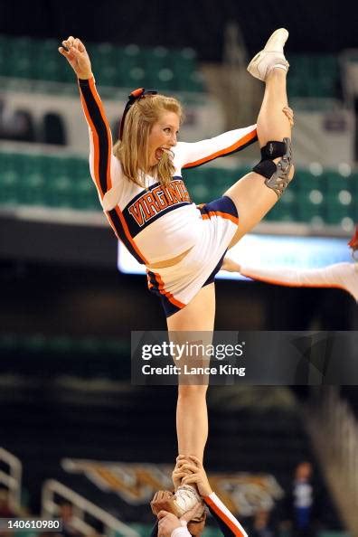 A Virginia Cavaliers Cheerleader Performs Against The Maryland News