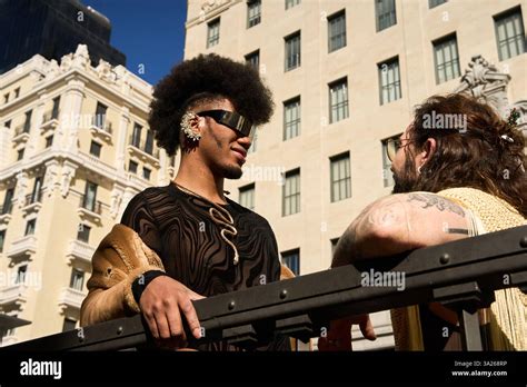 Two Androgynous Non Binary People Wearing Fashionable Clothing Are