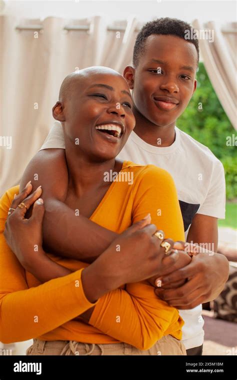 Portrait Of Mother And Son Embracing Stock Photo Alamy