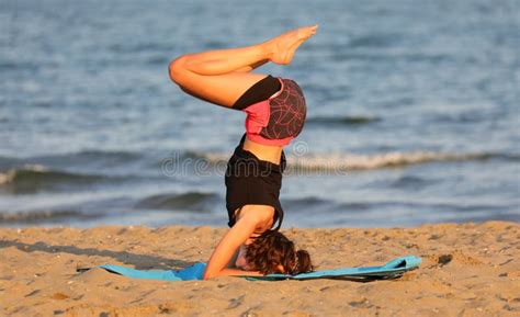 Girl Does Gymnastics On The Beach With A Pirouette Stock Image Image