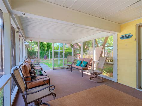 Spacious Screened In Back Porch Highlights The Living Space At This Downtown Milton Home The
