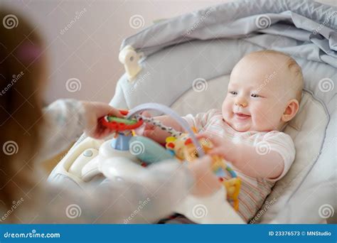 The Older Sister Looks Lovingly At Her Younger Sister Royalty Free