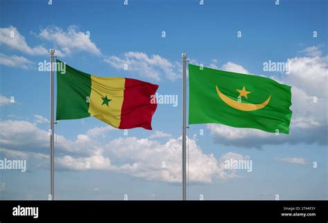 Mauritania And Senegal Flags Waving Together On Blue Cloudy Sky Two