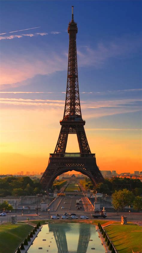 Straight View Of Eiffel Tower Paris During Sunrise With Blue Sky