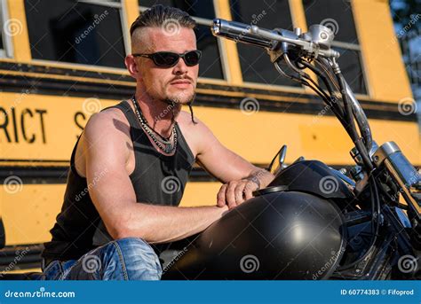 Tough Guy With Sun Glasses Lolling On His Chopper Motorcycle Stock