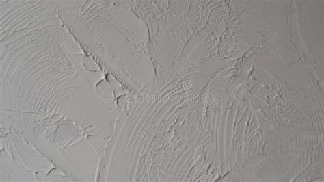 Applying Decorative Putty White Abstract Texture Of Surface Covered