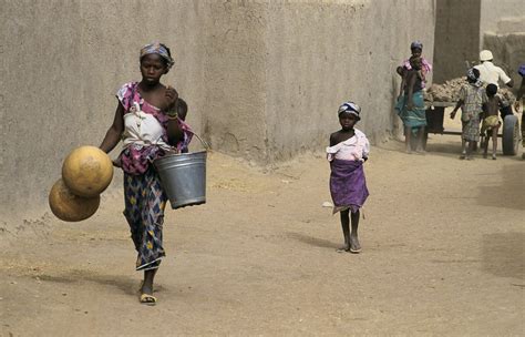 A Young Woman Carries Water Buckets A Woman Carries Water … Flickr