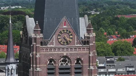 Aerial View Of Eindhoven Church With Clock And Urban Surroundings Buildings Stock Footage Ft