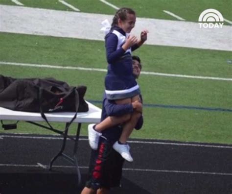 Teen Rushes Field To Perform With Crying 9 Year Old Cheerleader Whose Military Dad Couldnt