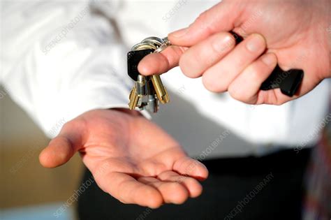 Hands Passing On Keys Stock Image C0311393 Science Photo Library