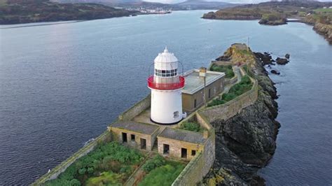 Aerial Of The Rotten Island Lighthouse With Killybegs In Background
