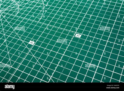 Angle View Photo Of Green Colored Cutting Mat Tool With Ruler And