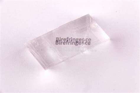 Optical Birefringence Demonstrated Using A Text Using A Natural Double