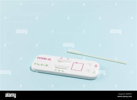 Close Up Image Of Rapid Test Kit Device For Covid 19 On Blue Surface