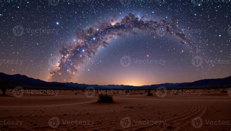 Breathtaking Night Sky Over Desert Landscape With Stars And Milky Way