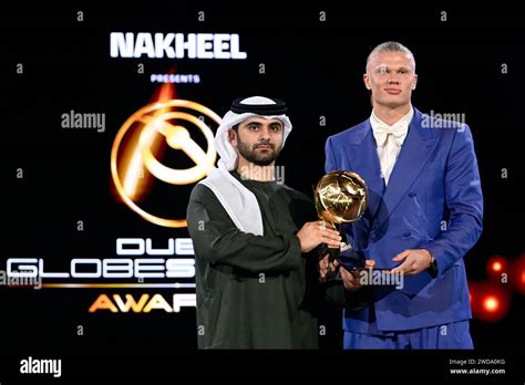 Erling Haaland Right Receives The Award As Best Player At The Globe