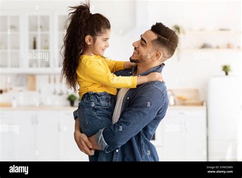 Father's Love. Portrait Of Loving Arab Dad Holding His Cute Little Daughter Stock Photo - Alamy