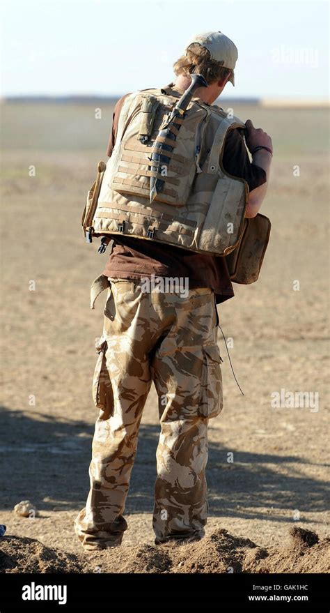 Prince Harry Puts On His Body Armour In The Desert In Helmand Province