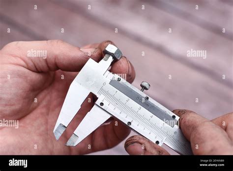 Measuring The Diameter Of The Nut Thread With A Caliper Stock Photo Alamy