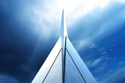 Premium Ai Image A Triangular Structure With A Blue Sky And Clouds