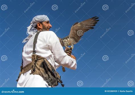 Falcon Male Indian Senior Handler In Arabic National Clothes With