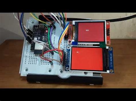 An Electronic Device With Many Wires Attached To It And Some Other Electronics On The Board