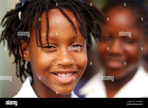 Barbados Island Farmers Close Up Portrait Of Schoolgirl With Braided Hair Smiling With A