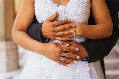 Premium Photo Black Ethnic Groom Holding Hands At A Beautiful Wedding