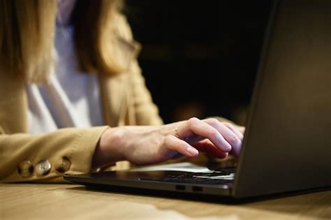 Premium Photo Female Hand Typing On Laptop Keyboard In Cafe