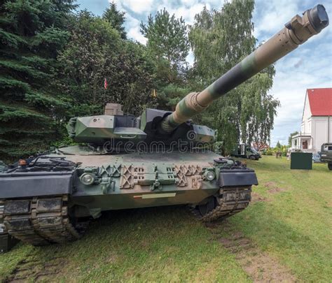 A Leopard Tank Standing On A Grassy Surface Polish Tank Among The