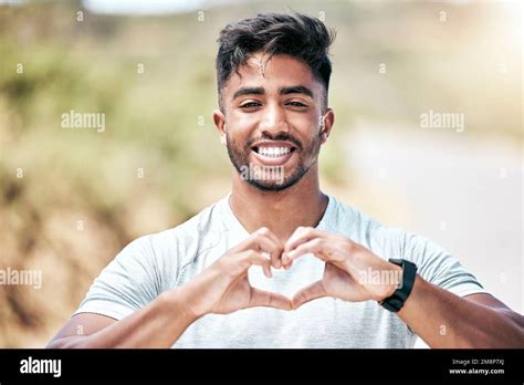 Portrait Happy Fit Young Mixed Race Man Making A Heart Shape With His