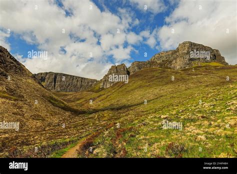 Towering Basalt Lava Cliffs Over Jurassic Sediments At The Quiraing