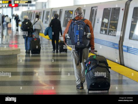 Passengers Make Their Way To A Bart Train At San Francsico