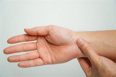 Health Care Concept Asian Man Holding His Wrist With Office Syndrome