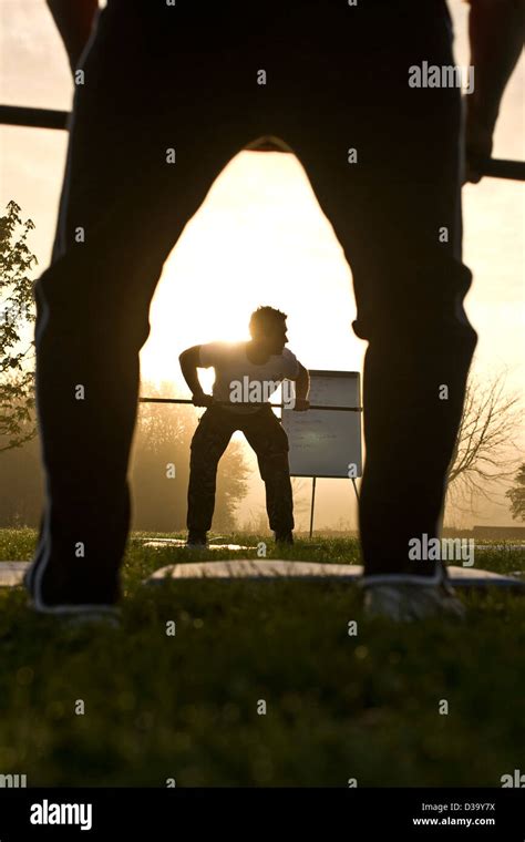 Fitness Instructor Leading Weight Lifting Class At Luxury Boot Camp Kingston House Totness