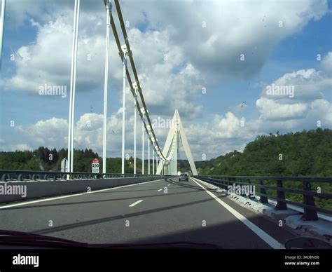A Modern Suspension Bridge With A Unique Design Featuring Tall White