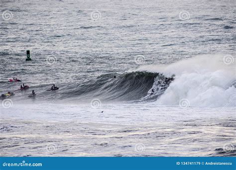 Surfers Riding Huge Waves On The West Coast Close To Pillar Point And