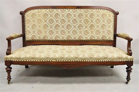 Antique Eastlake Victorian Carved Walnut Floral Upholstered Parlor Sofa