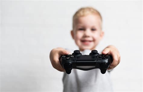Free Photo Unfocused Little Boy Holding A Controller