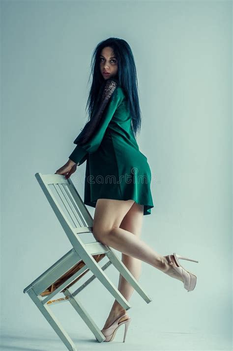 Semi Nude Beautiful Girl Posing On A Chair In A Classic Suit Stock