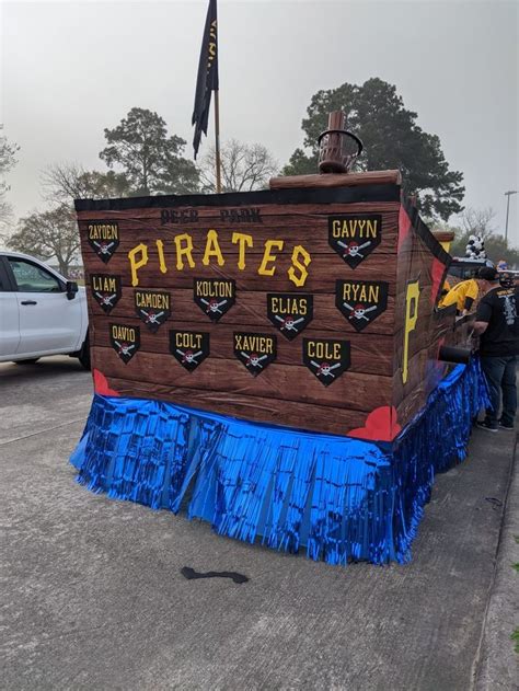 There Is A Float That Says Pirates On The Front And Sides With Fringes