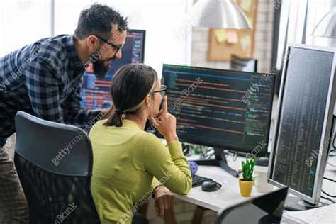 Couple Software Engineer Developer Use Computer Work On Program